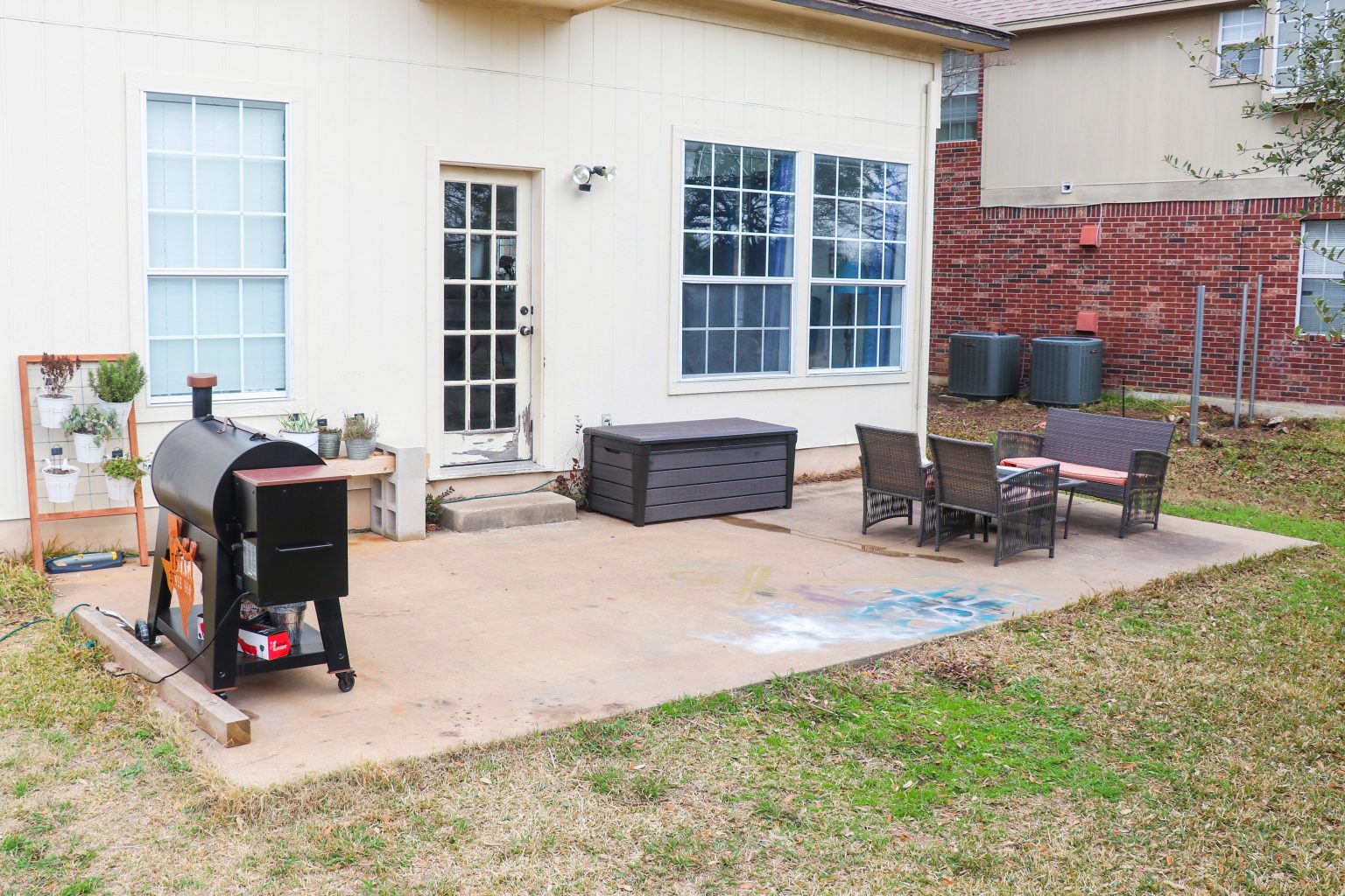 Resurfacing a concrete patio for a budget DIY patio makeover - Fab Everyday